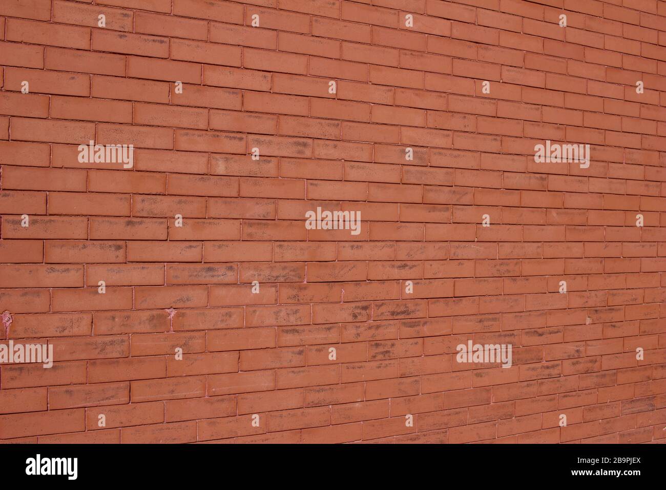 Antique burnt orange color brick wall texture background with aging ...