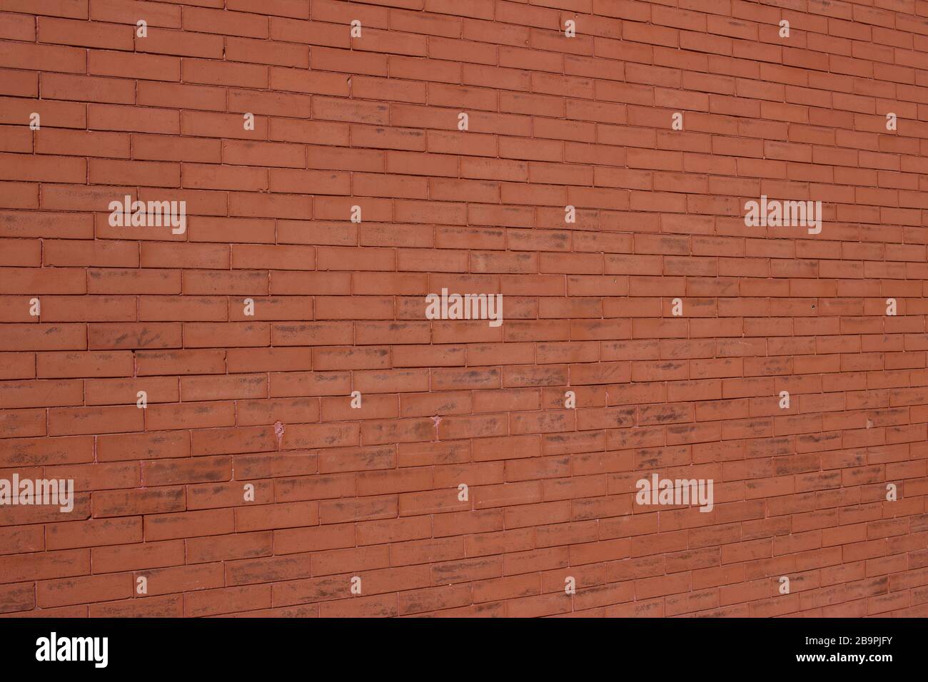 Antique burnt orange color brick wall texture background with aging ...