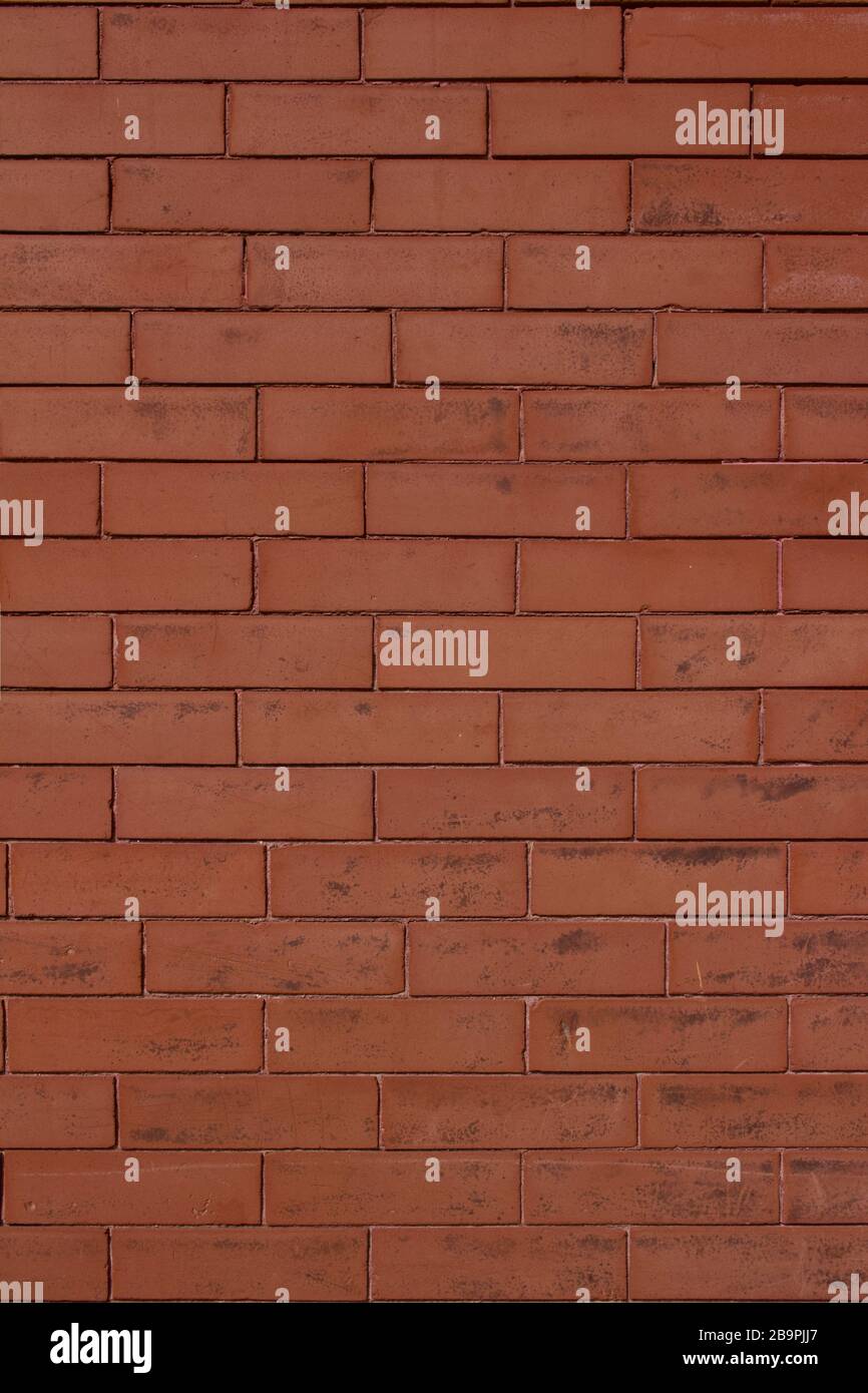 Antique burnt orange color brick wall texture background with aging ...