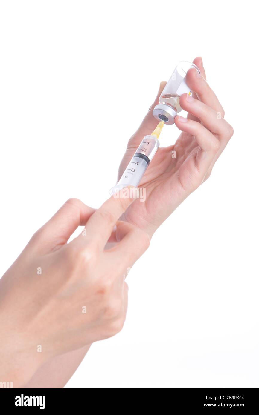 Doctor with medical syringe in hands, getting ready for injection Stock ...