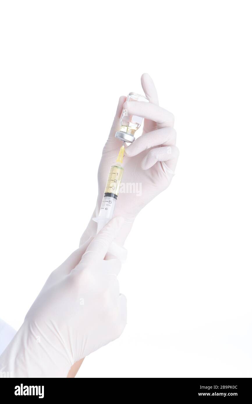 Doctor with medical syringe in hands, getting ready for injection Stock ...