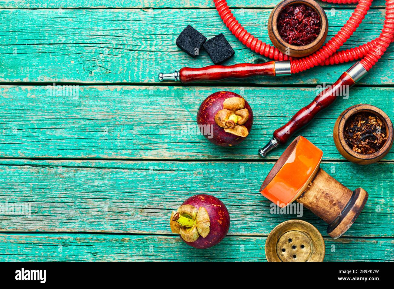 Making hookah with fruit tobacco.Hookah with the aroma of tropical ...