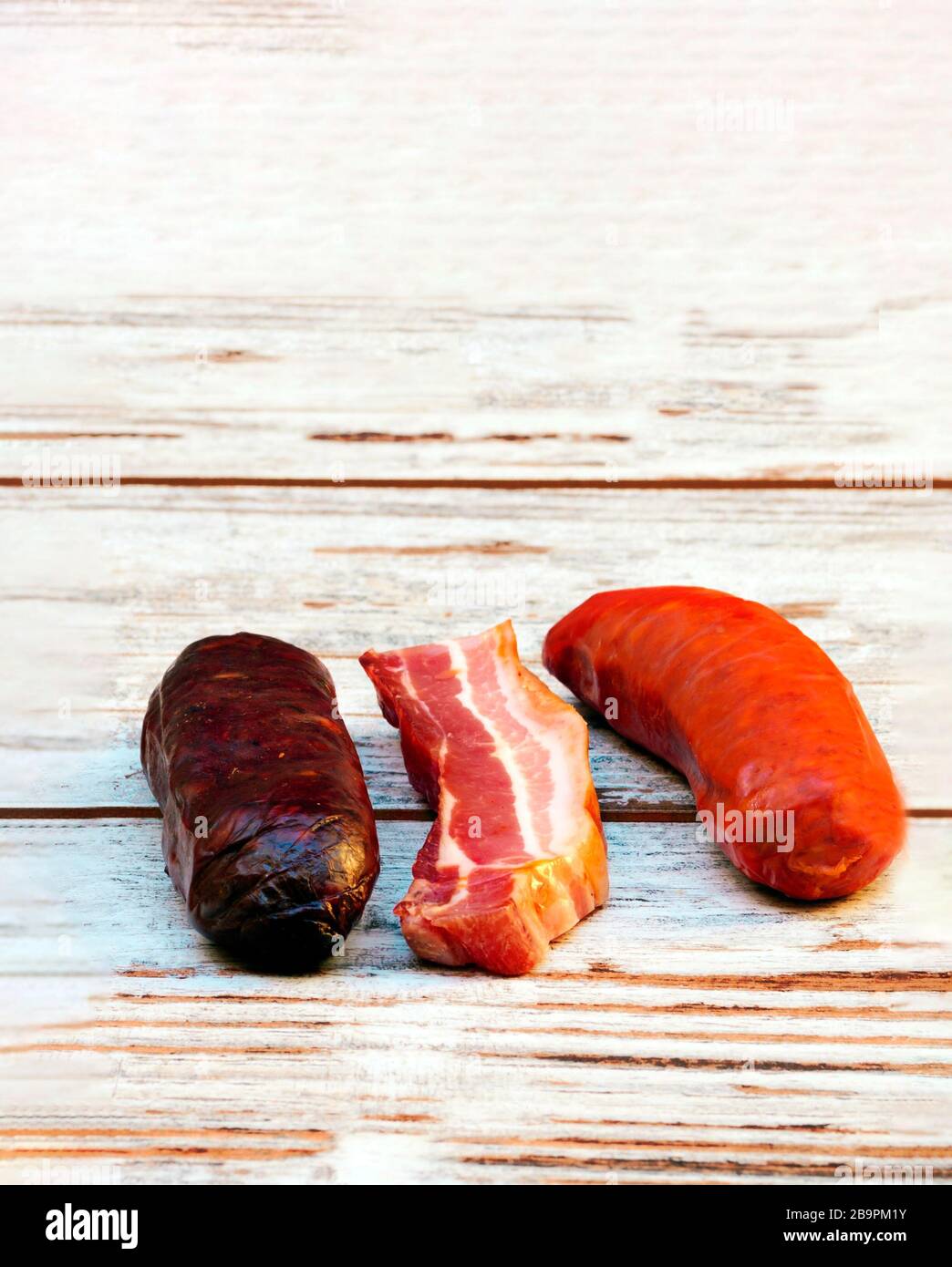 Chorizo surrounded by rustic background Stock Photo - Alamy