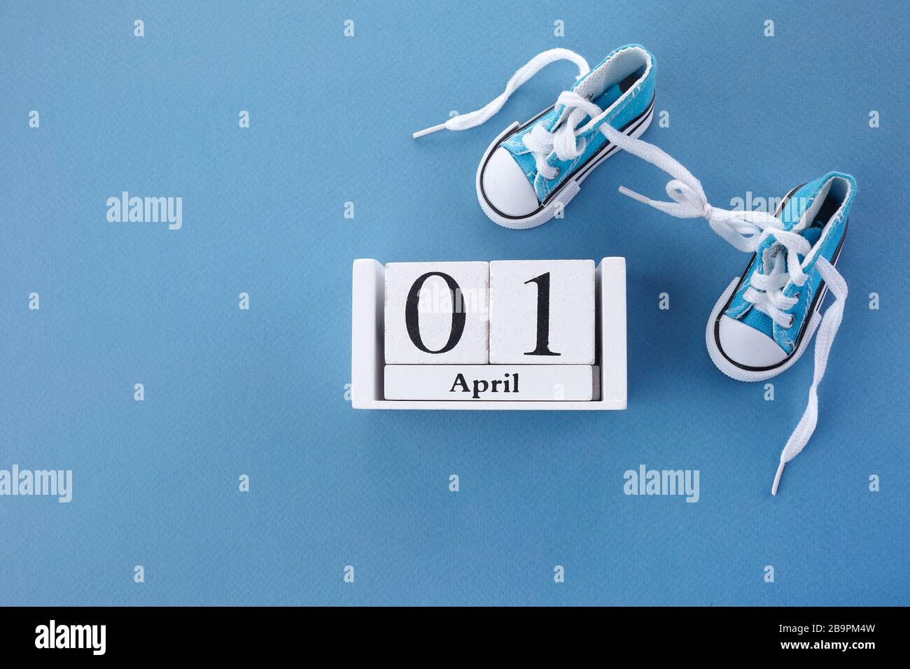 April fool's day. Surprise symbol. Shoelaces tied together on blue ...