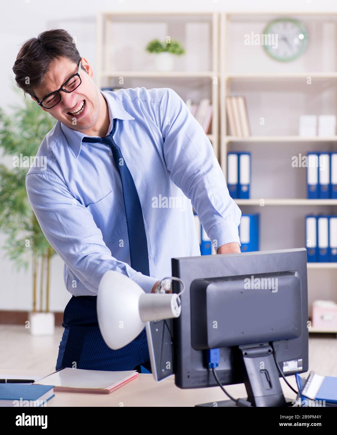 The angry businessman frustrated with too much work Stock Photo - Alamy