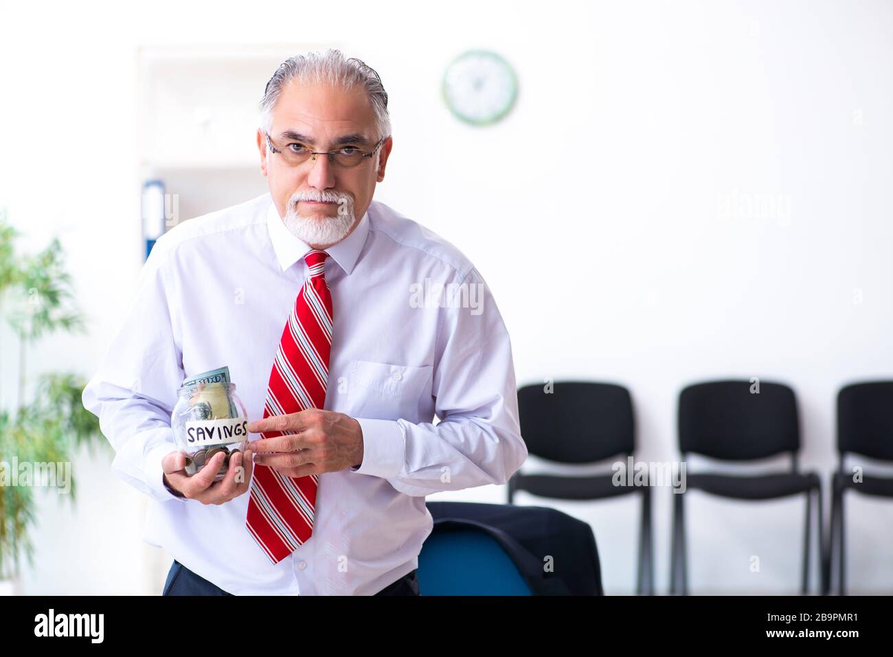 Old accountant in budget planning concept Stock Photo - Alamy