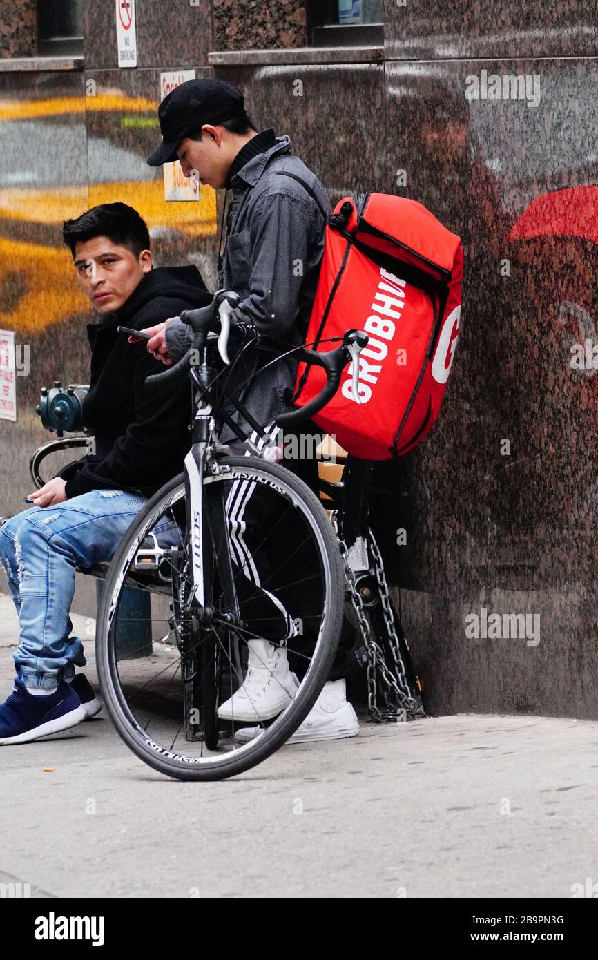 A person with a Grubhub delivery backpack bin the wake of the ...