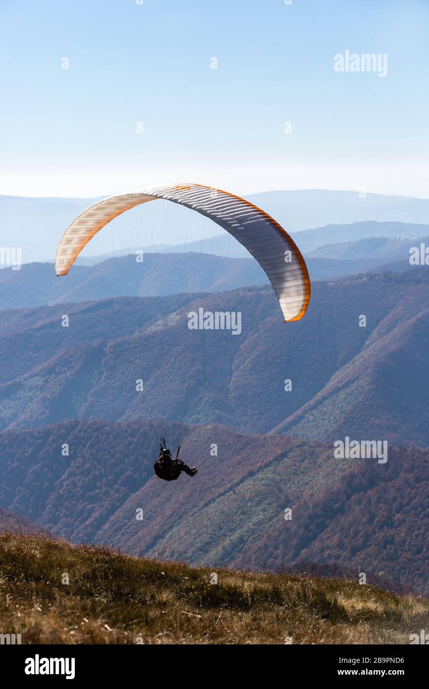 Paraglider fly over mountain hi-res stock photography and images - Alamy