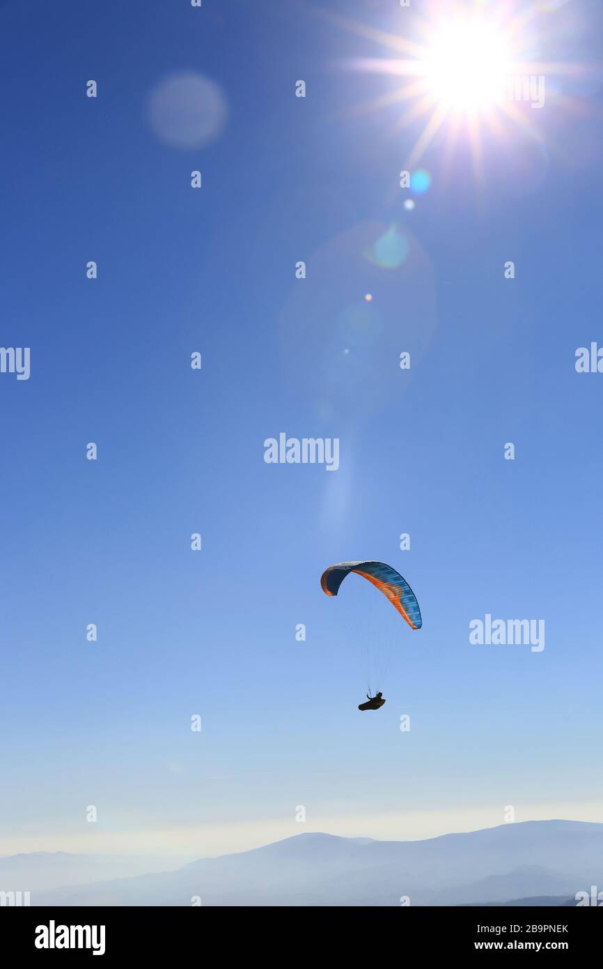 flying paraglider in air with sunshine Stock Photo - Alamy