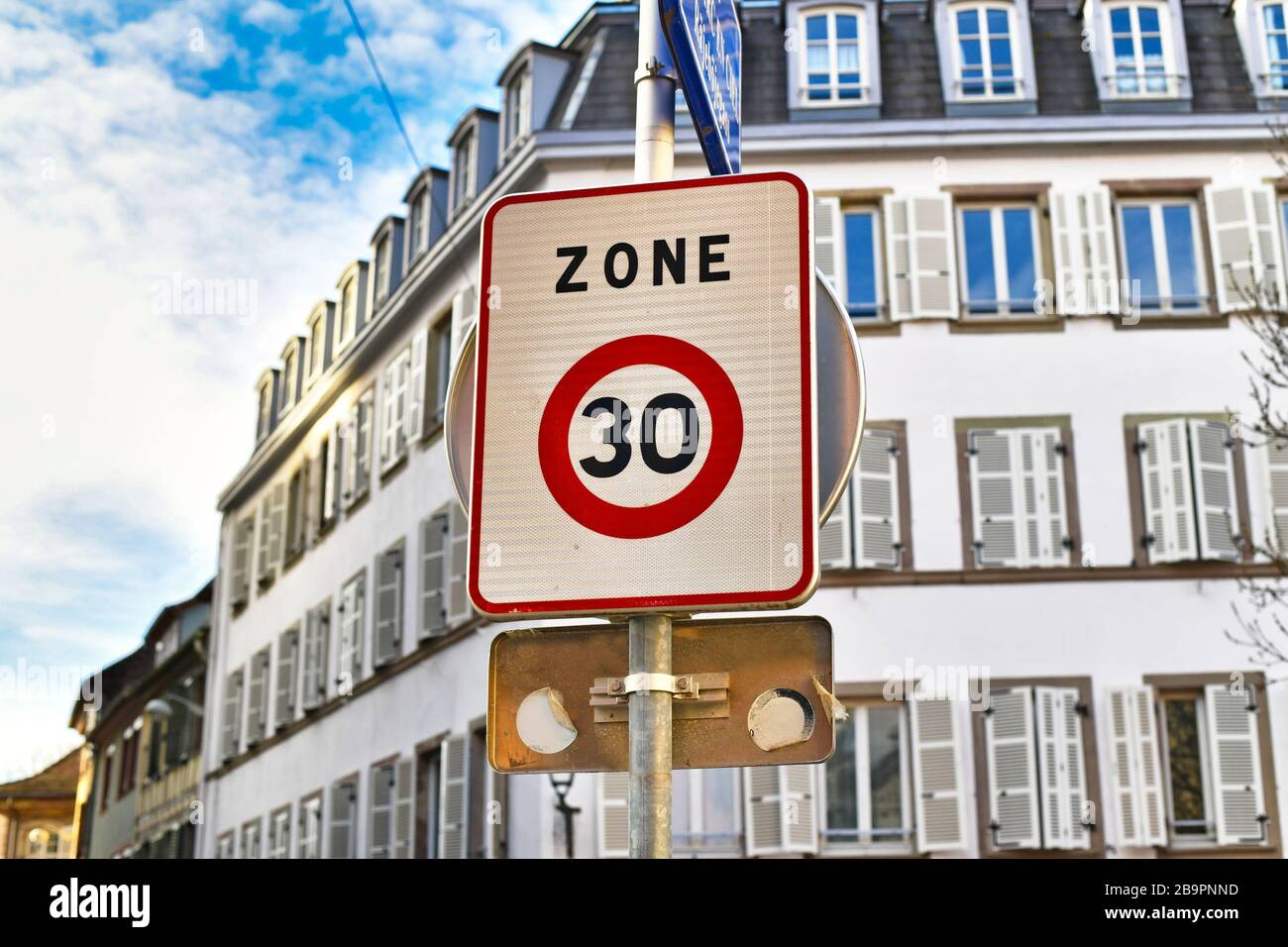 Square shaped 30km/h speed limit zone sign in front residential ...