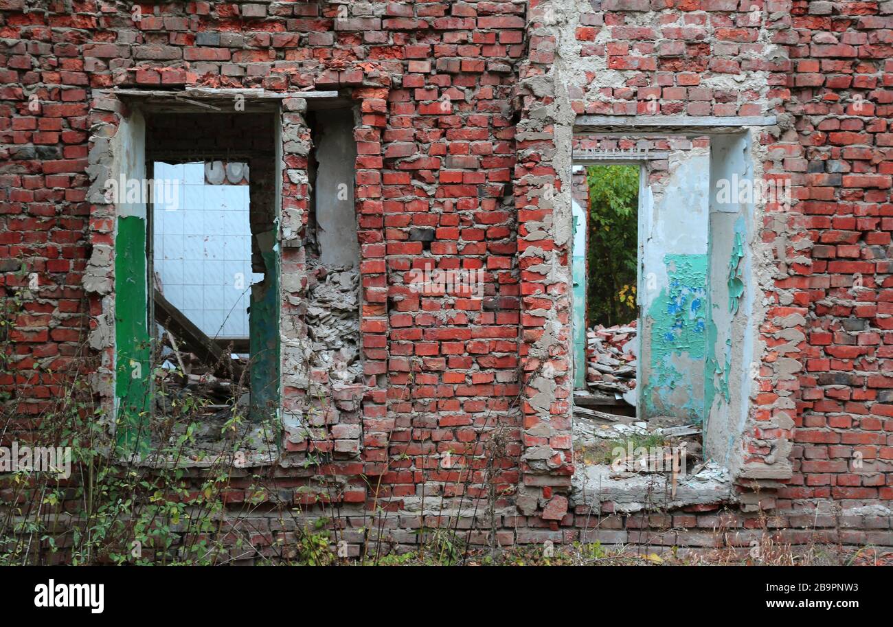 old abandoned house, ruin, red brickwork and window frames Stock Photo ...