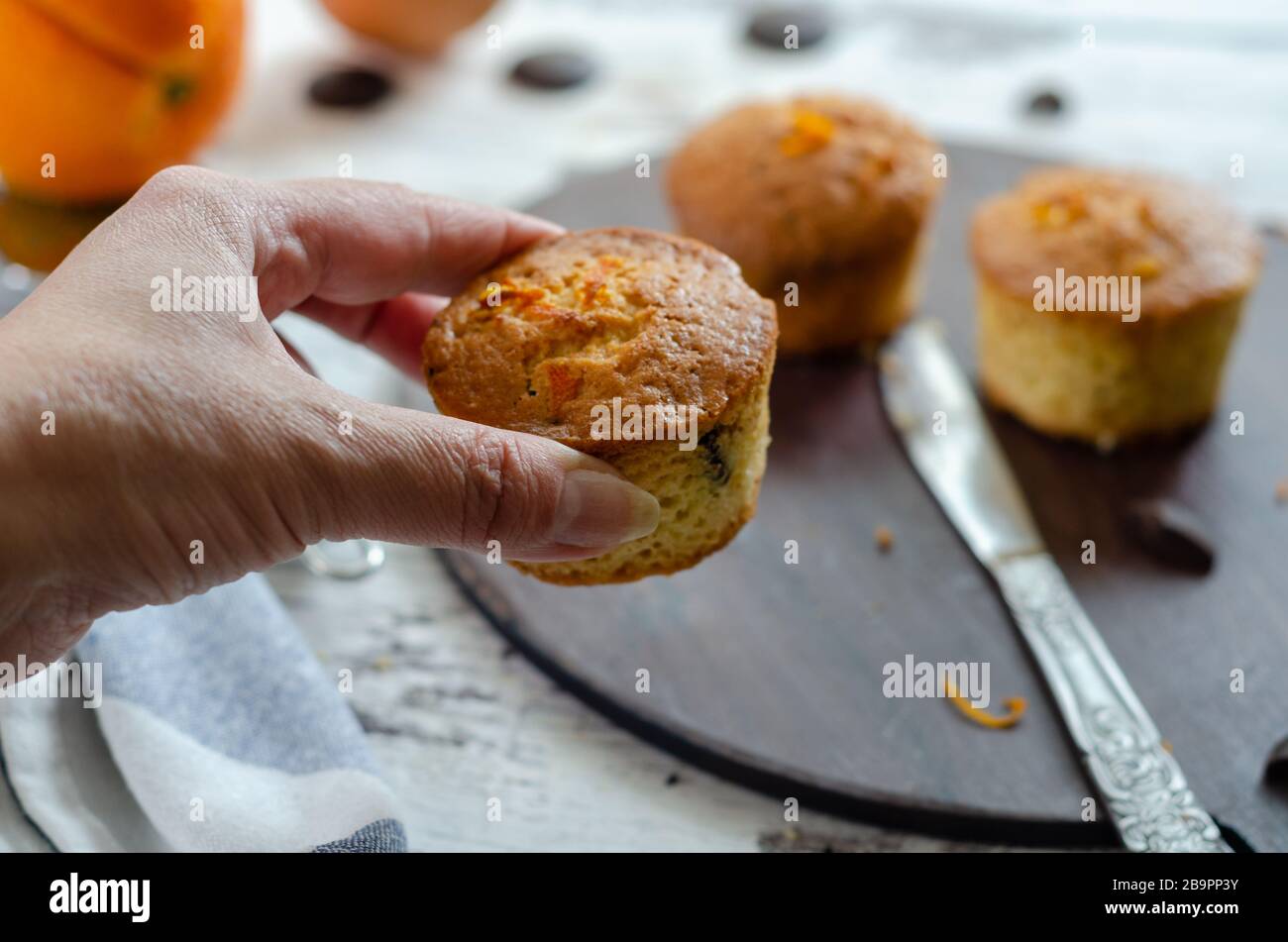 The woman is holding a muffin,top view Stock Photo - Alamy
