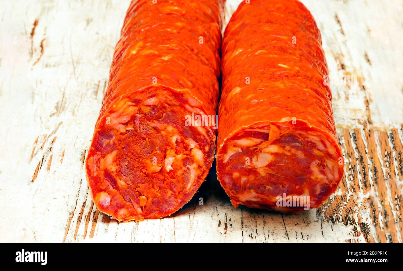 Chorizo surrounded by rustic background Stock Photo - Alamy