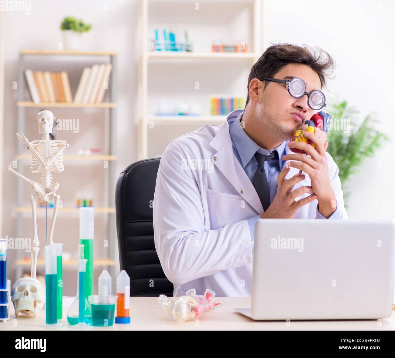 The funny doctor having fun in hospital lab Stock Photo - Alamy
