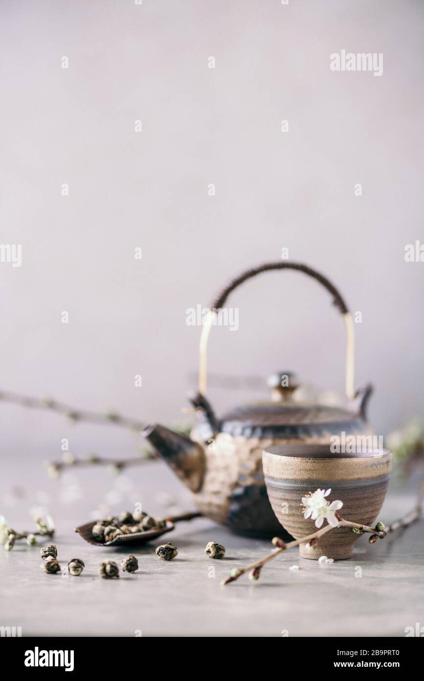 Traditional asian tea ceremony arrangement. Flat lay of iron teapot ...