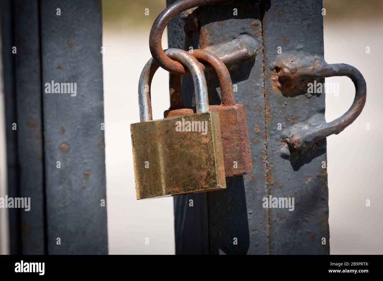 pair of rusty old locks on gate Stock Photo - Alamy
