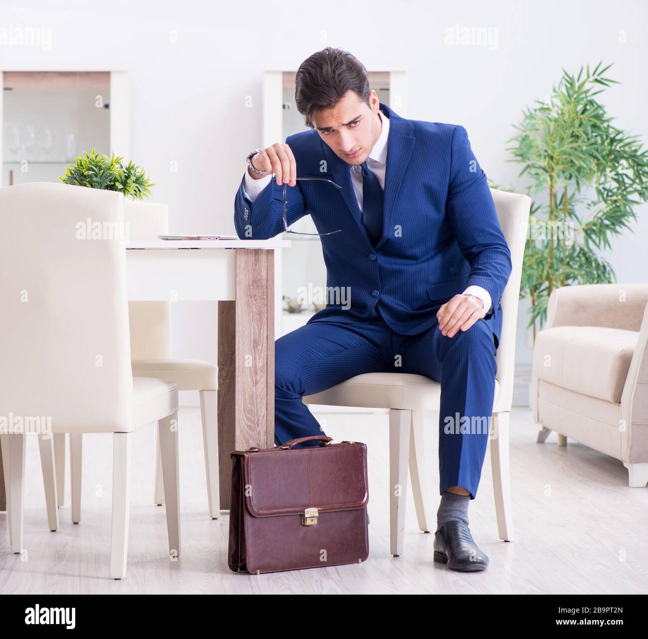 The bankrupt businessman angry and upset at home Stock Photo - Alamy