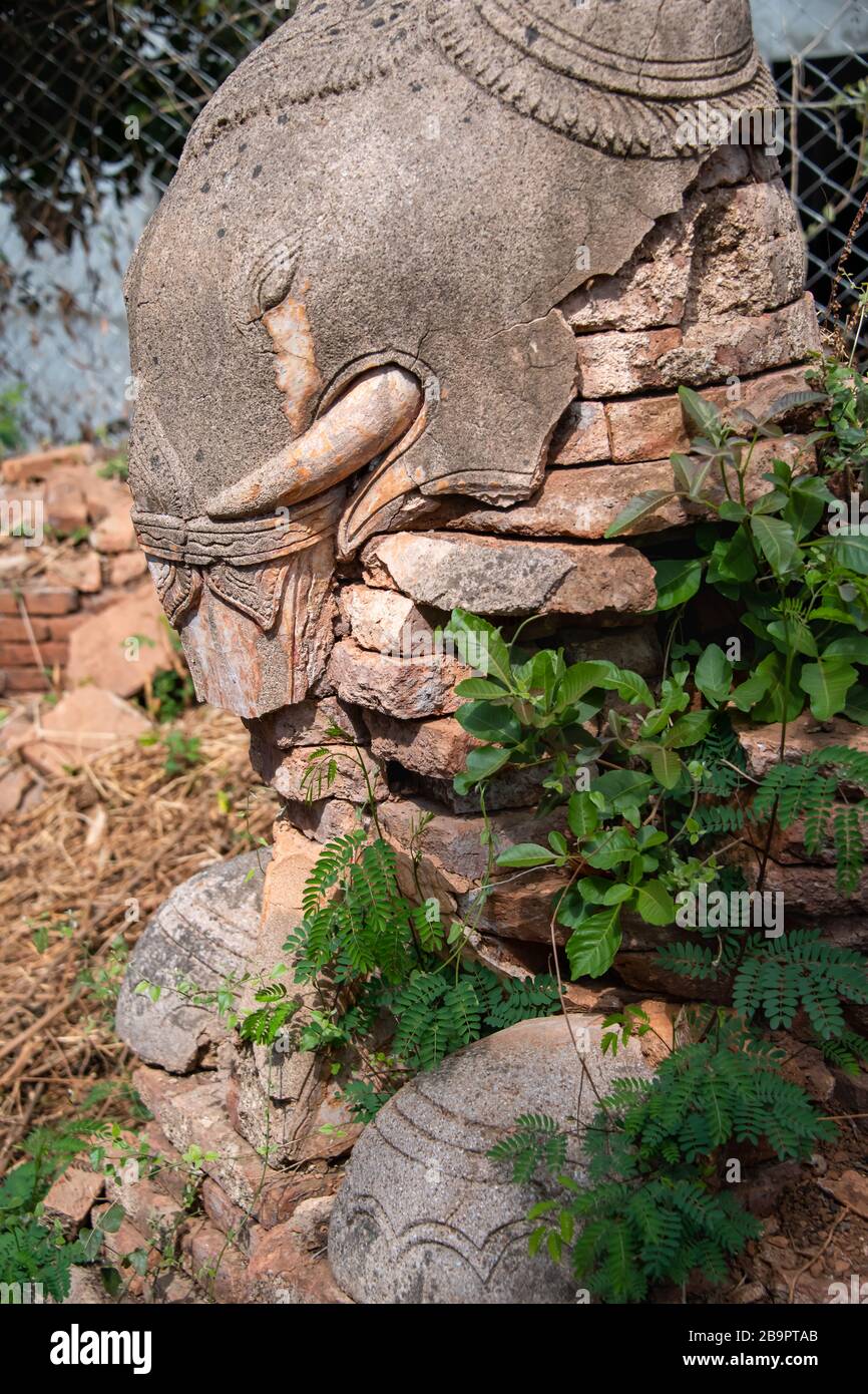The ruins of an ancient elephant carving, Schwe Indein pagoda complex ...