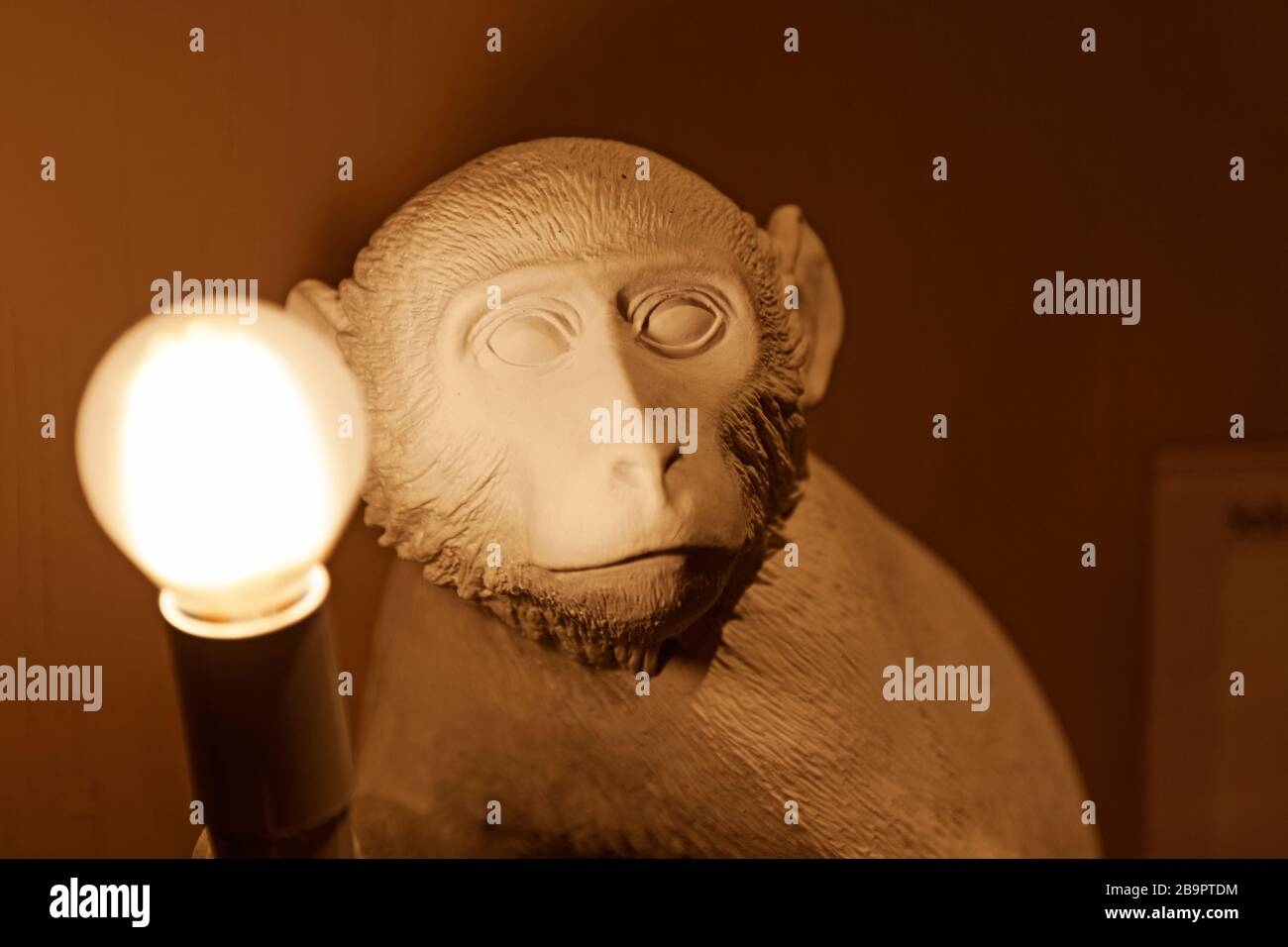 Umea, Norrland Sweden - March 14, 2020: a plaster monkey holding in a ...