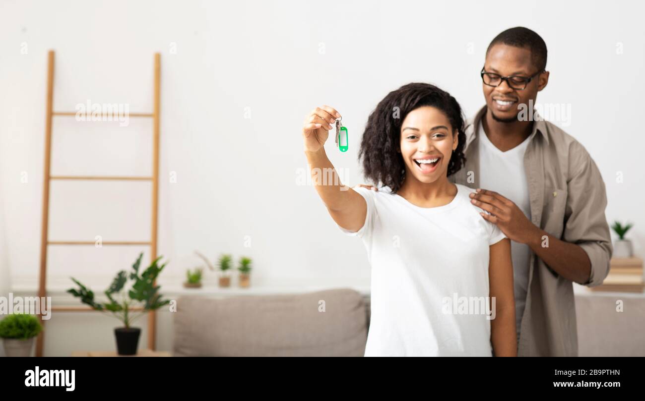 Husband and wife hold keys at home Stock Photo - Alamy