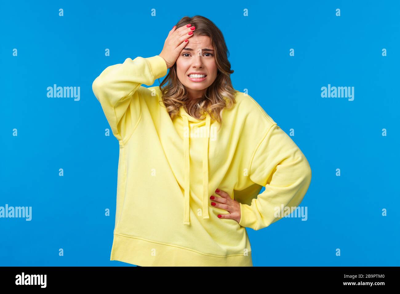 Embarrassed and worried girl bumped into car, feel anxious and ...