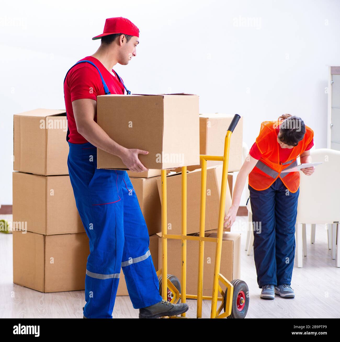 The professional movers doing home relocation Stock Photo - Alamy