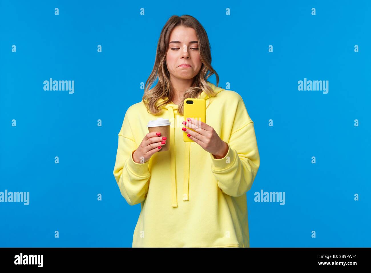 Girl checking out her photo on smartphone screen with not bad ...