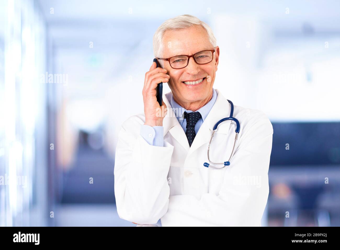 Senior doctor making phone call hi-res stock photography and images - Alamy