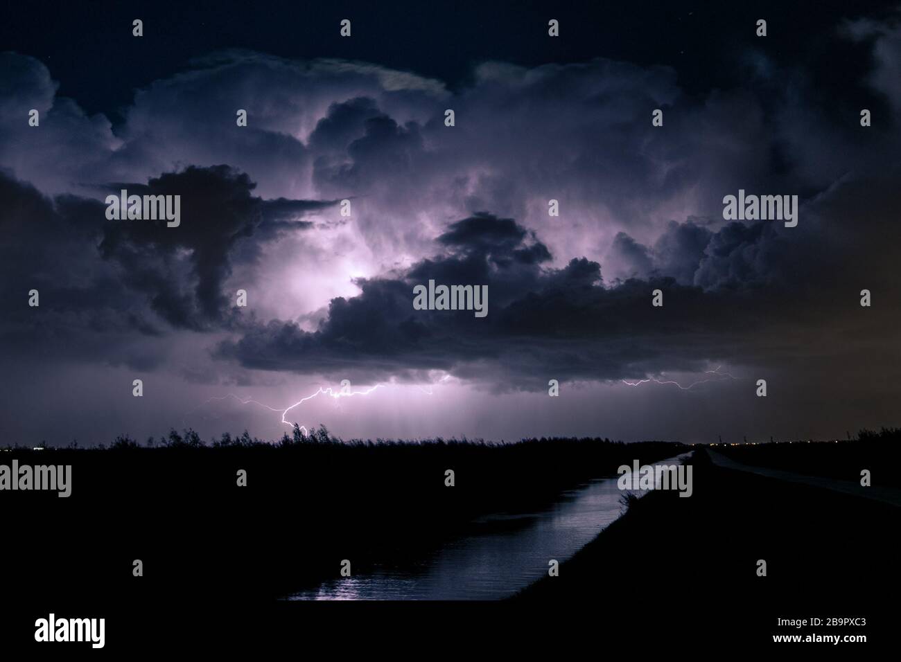 Lightning bolt from a huge thunderstorm hits the ground Stock Photo - Alamy