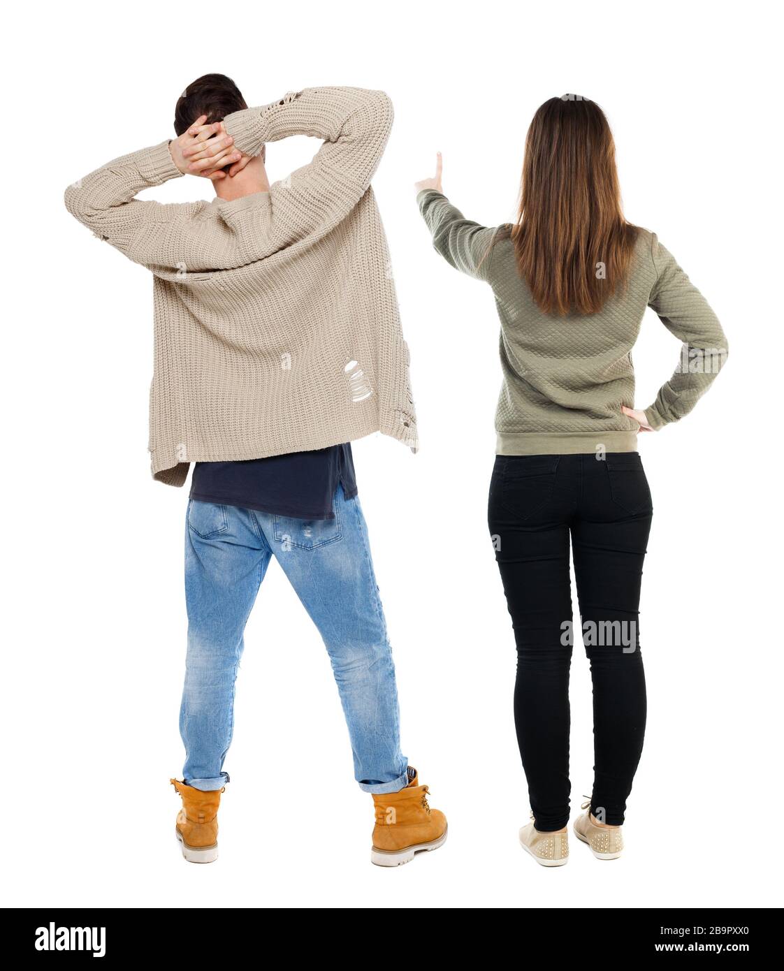 Back view of couple in sweater pointing. Rear view people collection ...