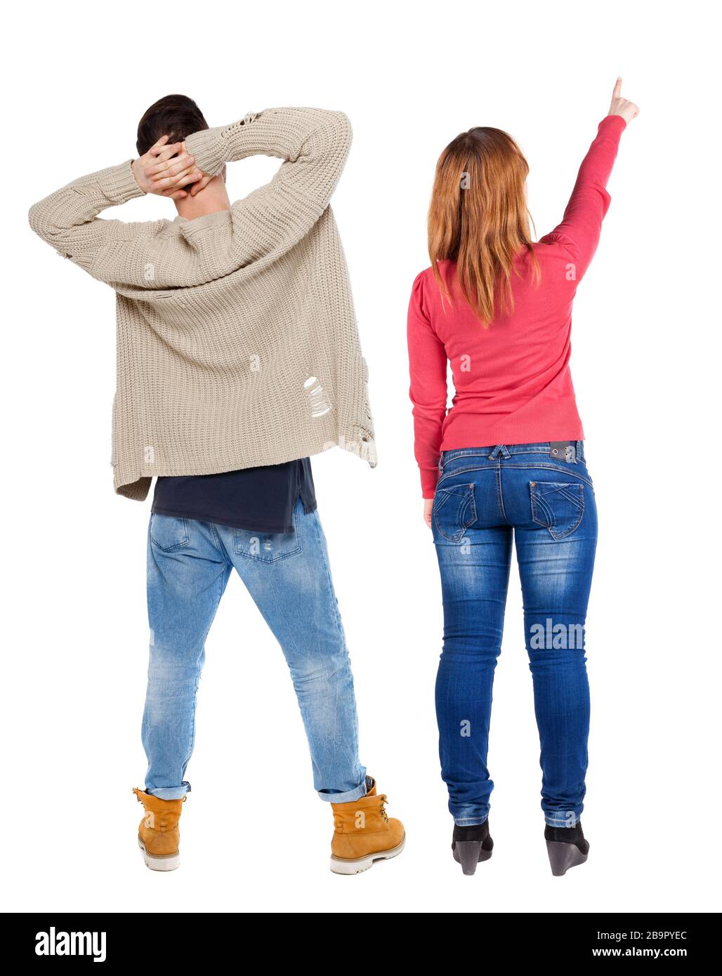 Back view of couple in sweater pointing. Rear view people collection ...