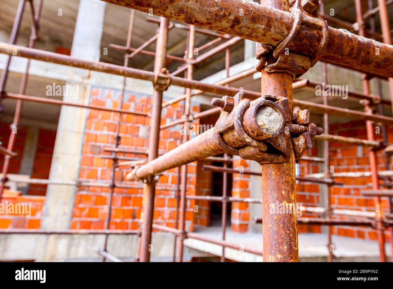 Scaffold is placed against edifice, building under construction Stock ...