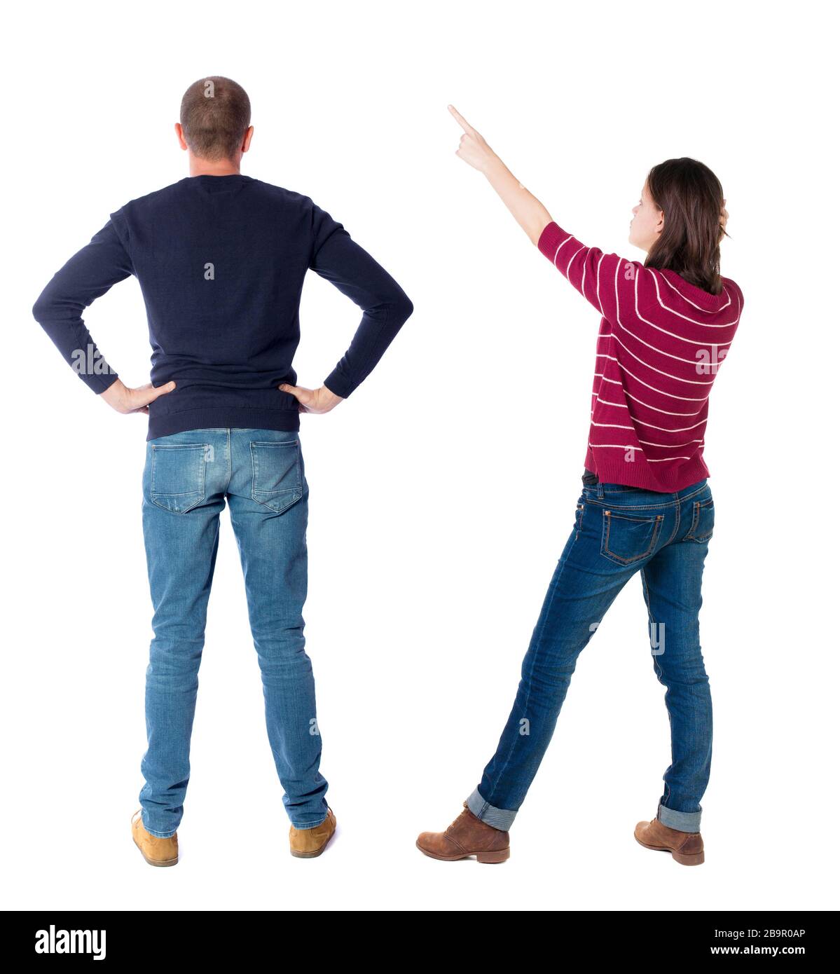 Back view of couple in sweater pointing. Rear view people collection ...