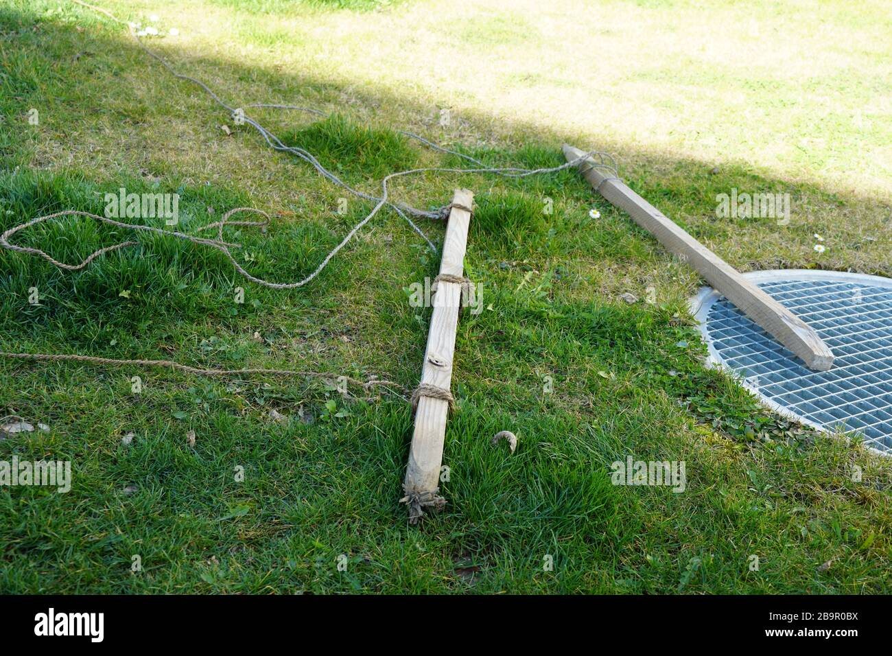 Two poles for delimitation of ground connected by a cord left behind on ...