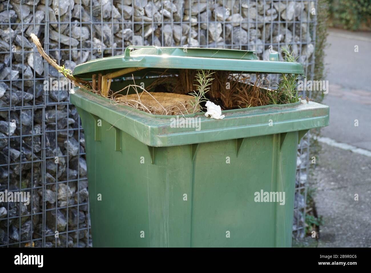 Organic waste container with a used paper tissue as source of virus or ...
