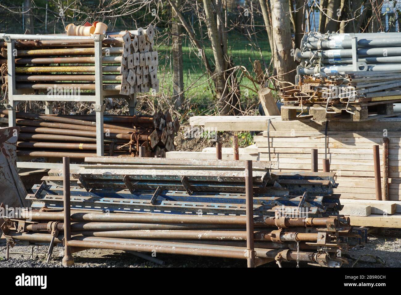scaffolding metal pipes piled according to dimensions on a storage ...