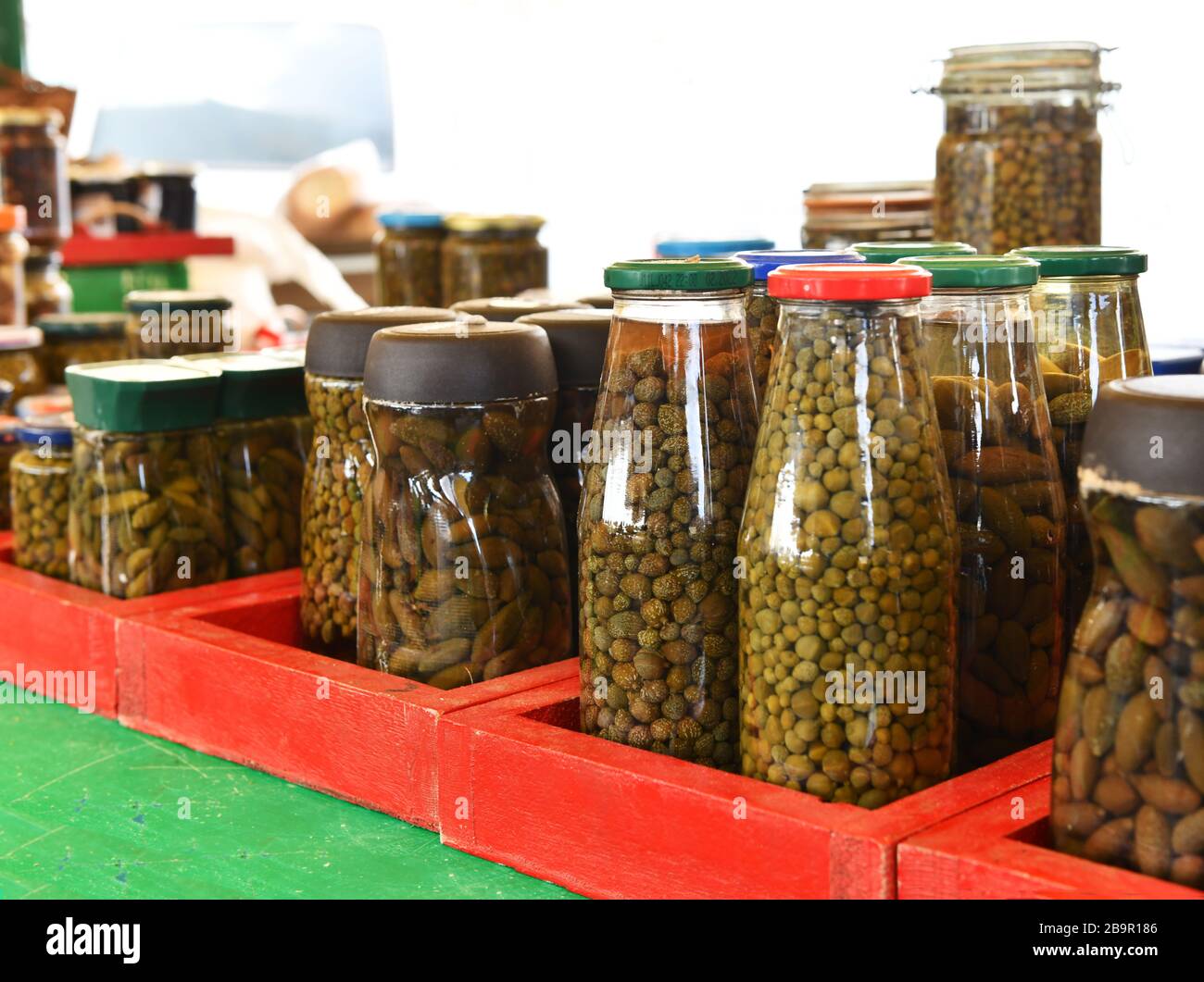 Homemade pickled caper in a jar.Pickled caper berries in jar isolated ...