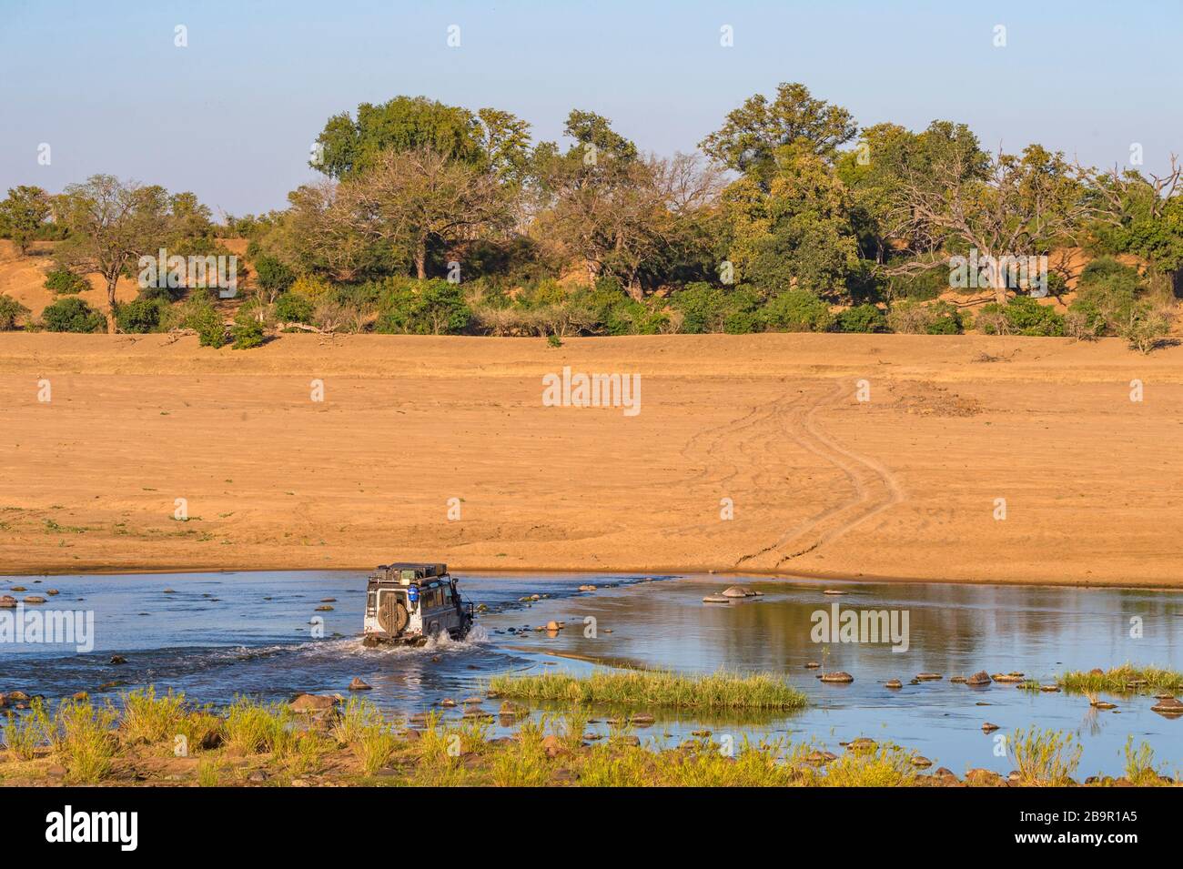 A 4x4 vehicle crosses the Runde River in Zimbabwe's Gonarezhou National ...
