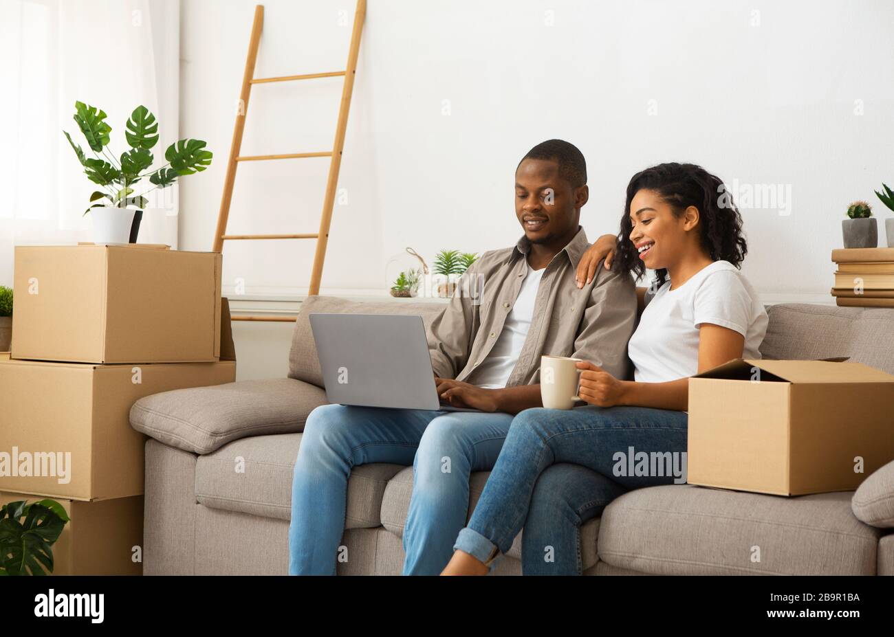 African american couple getting ready for repair Stock Photo - Alamy