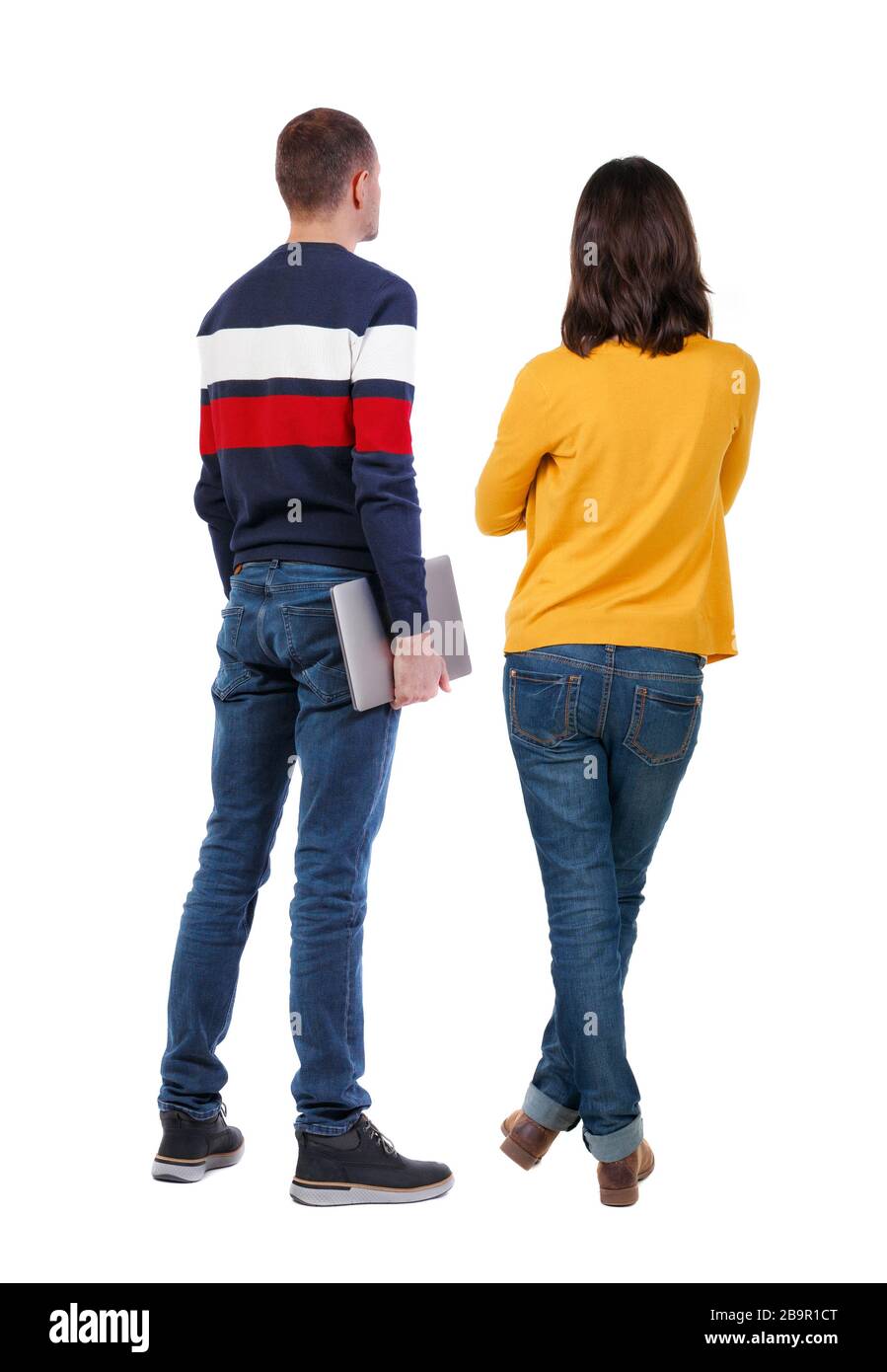Back view couple with laptop in sweater. beautiful man and woman. Rear ...