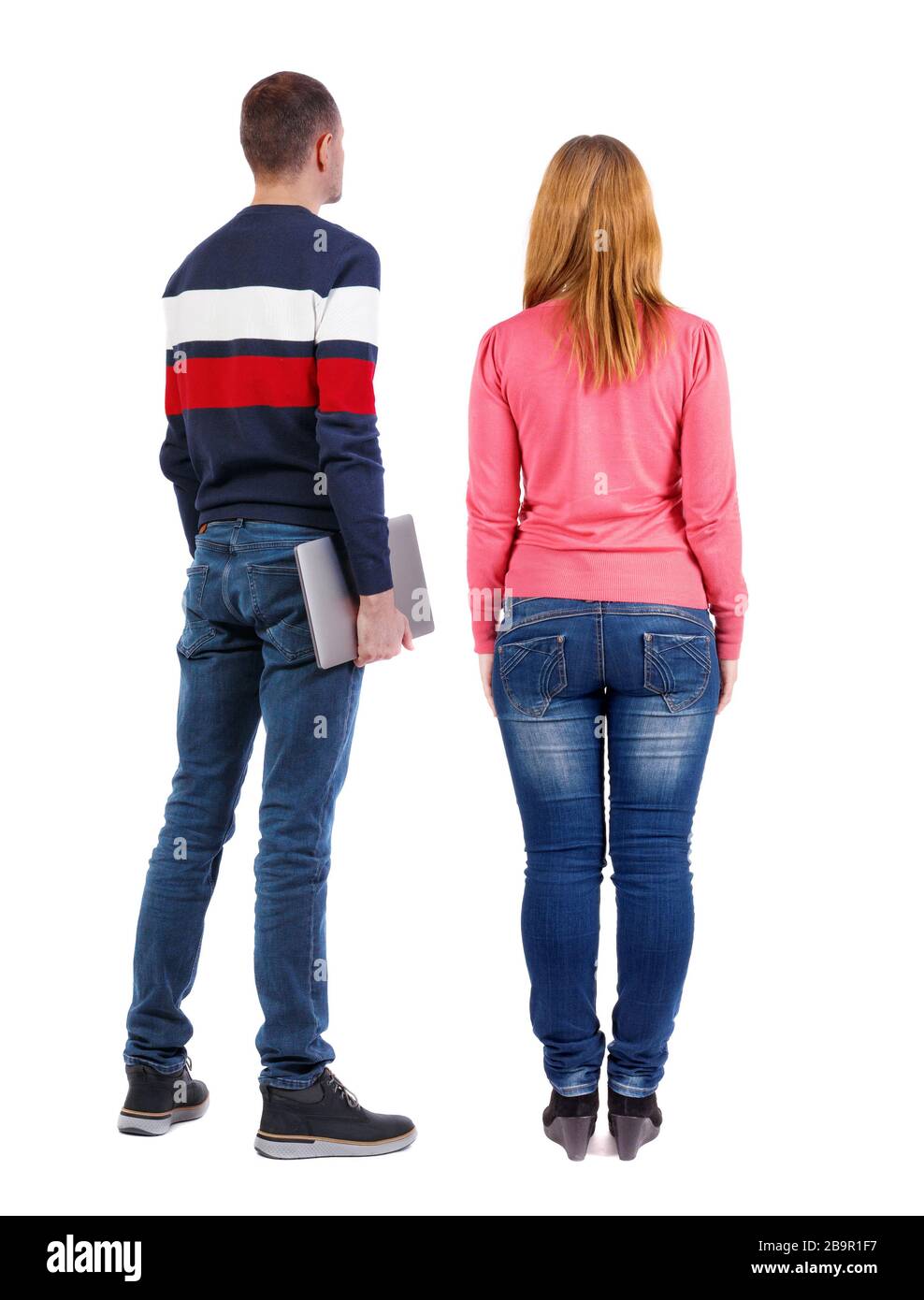 Back view couple with laptop in sweater. beautiful man and woman. Rear ...