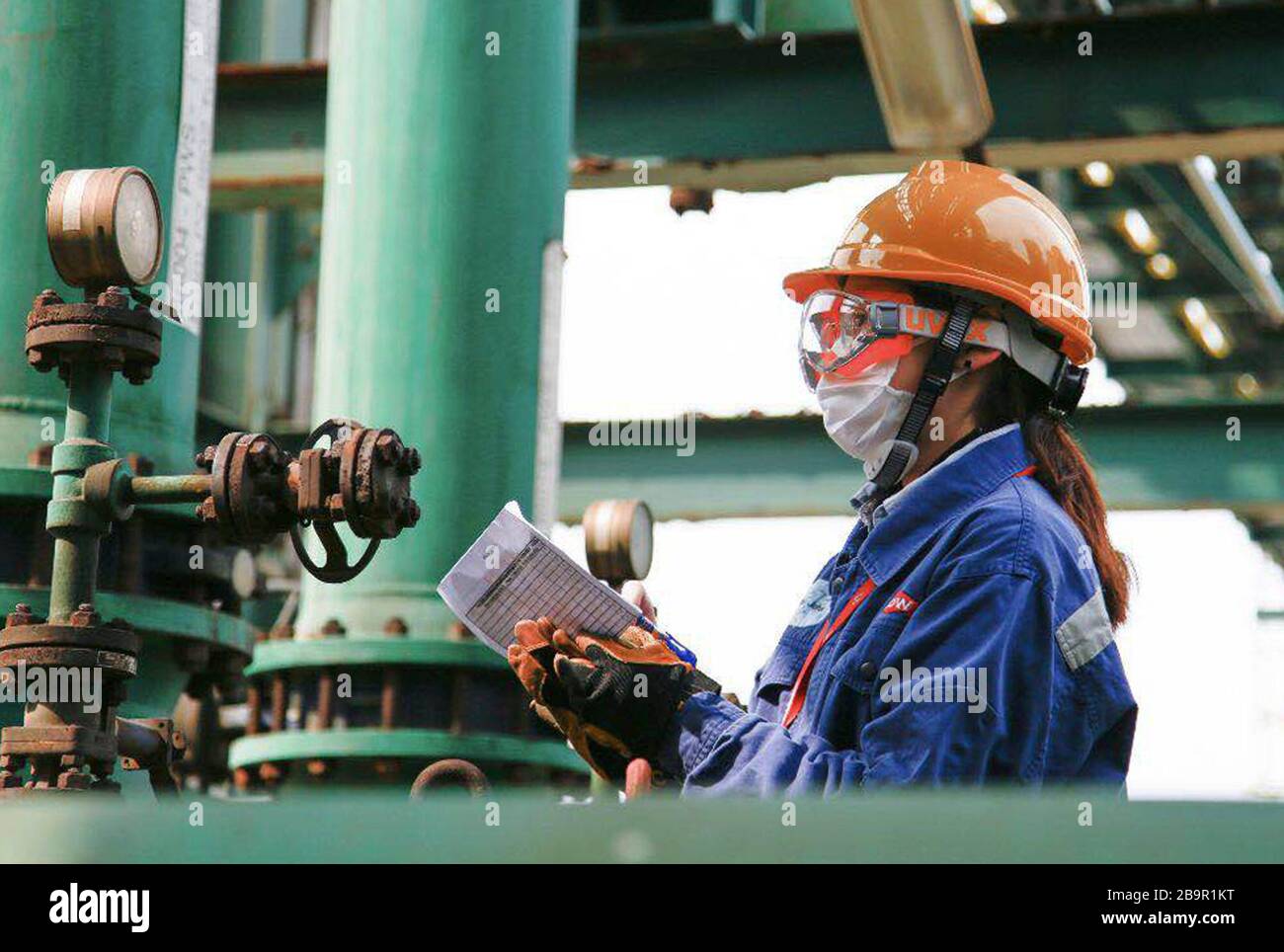 Beijing, China. 25th Mar, 2020. An employee works at a base of Dow ...