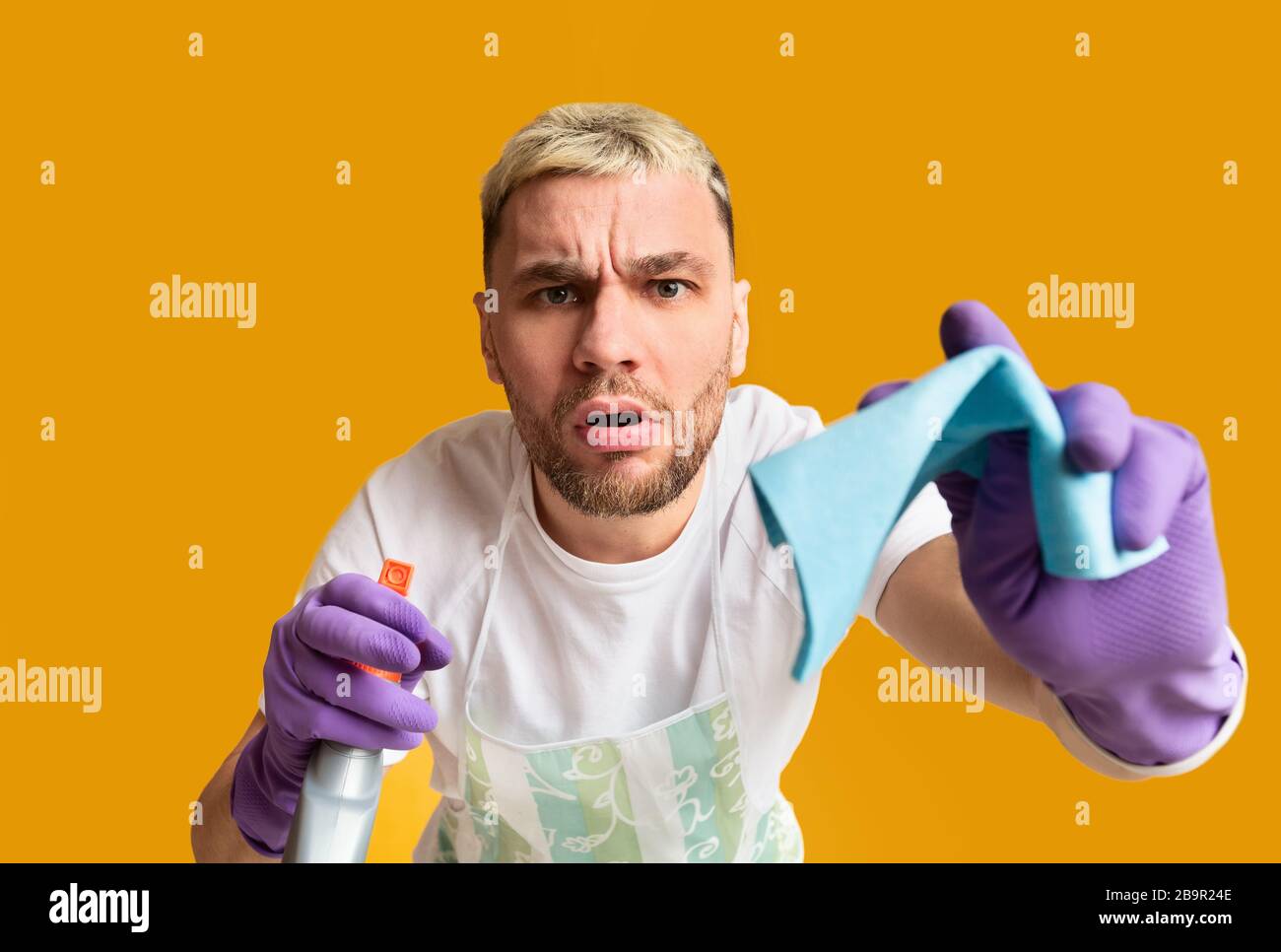 Housekeeping concept. Funny boy wiping screen sponge Stock Photo - Alamy