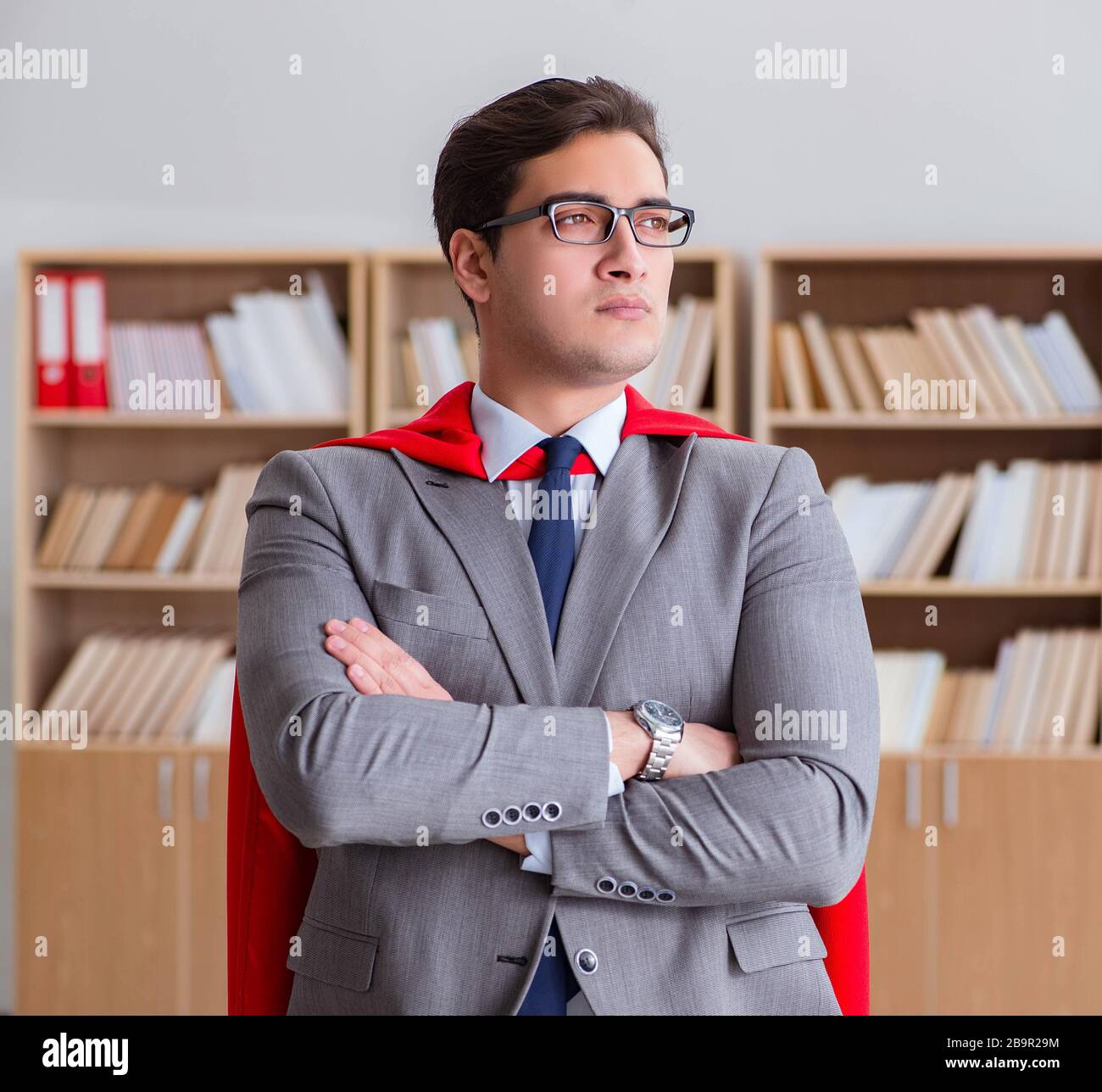 The superhero businessman working in the office Stock Photo - Alamy