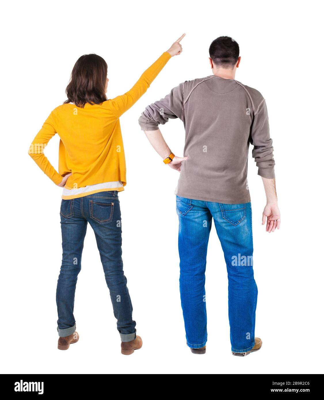 Back view of couple in sweater pointing. Rear view people collection ...