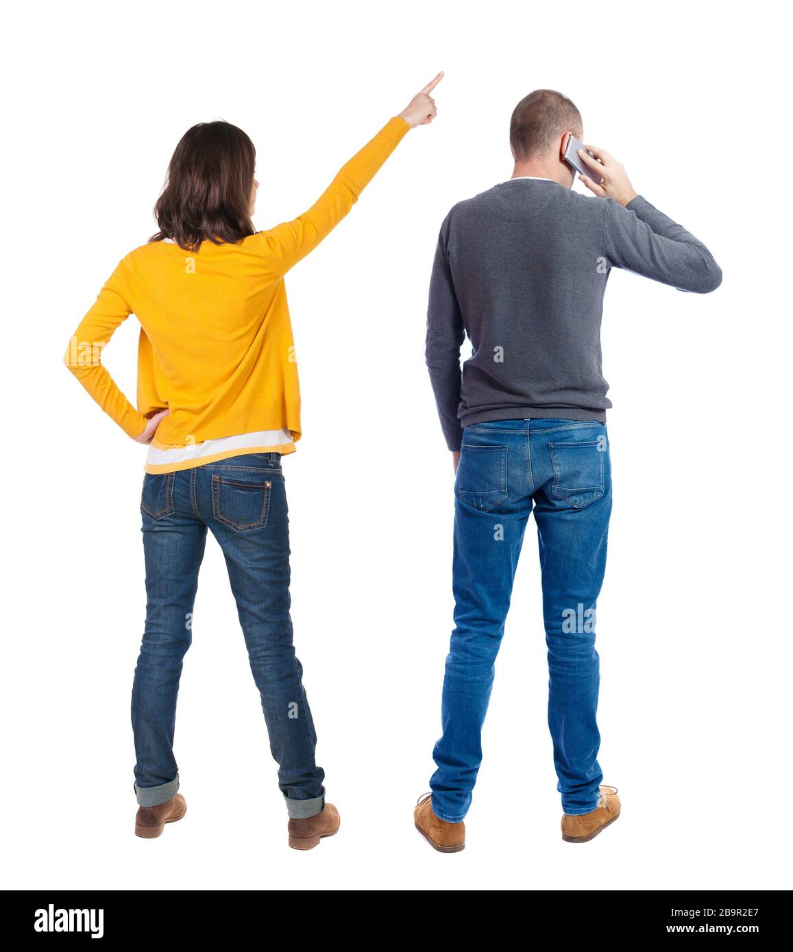 Back view of couple in sweater pointing. Rear view people collection ...