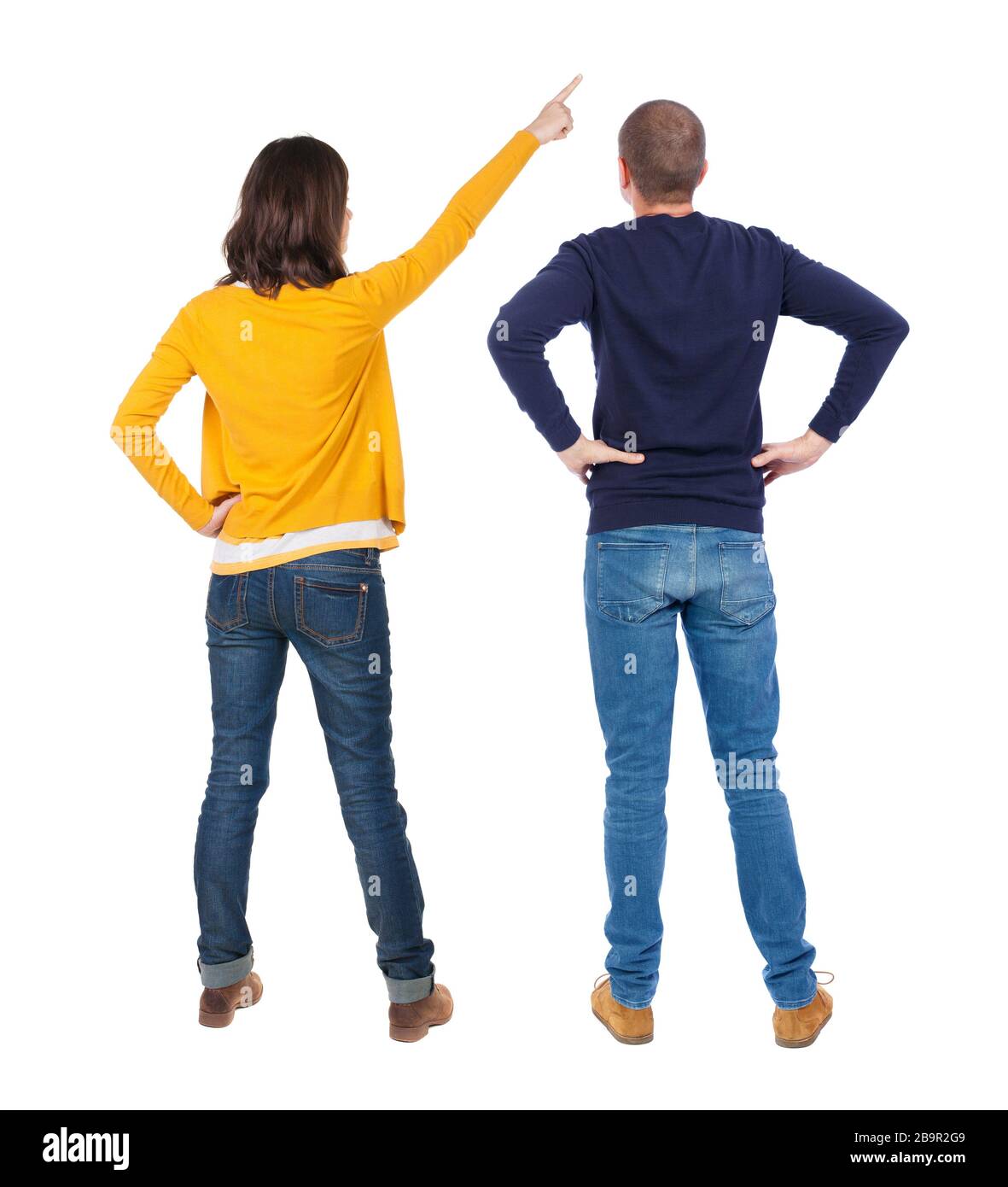 Back view of couple in sweater pointing. Rear view people collection ...
