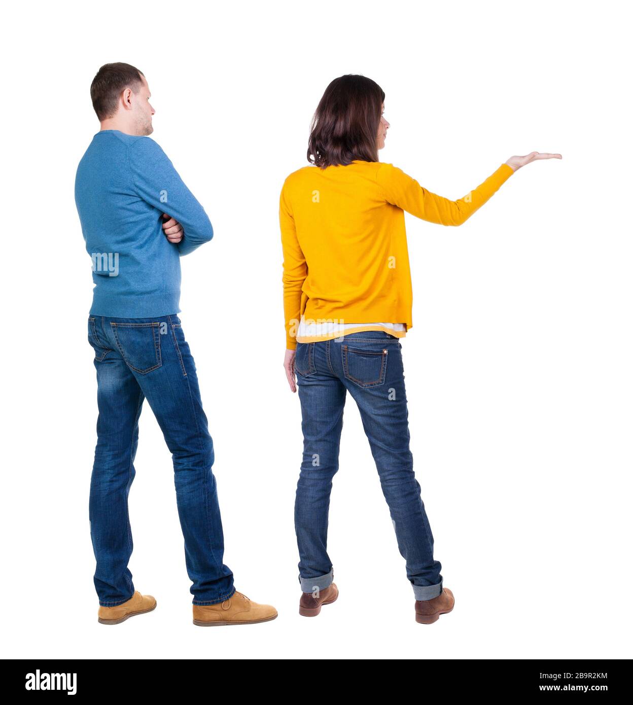 Back view of couple in sweater pointing. Rear view people collection ...