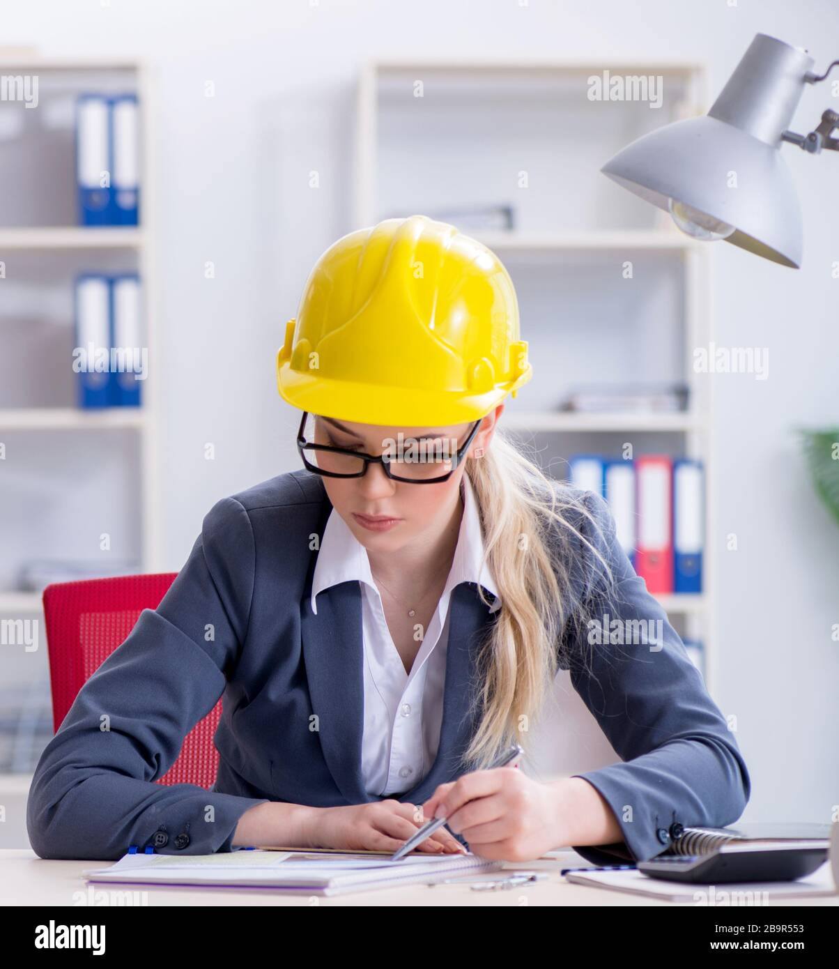 The woman architect working on the project Stock Photo - Alamy