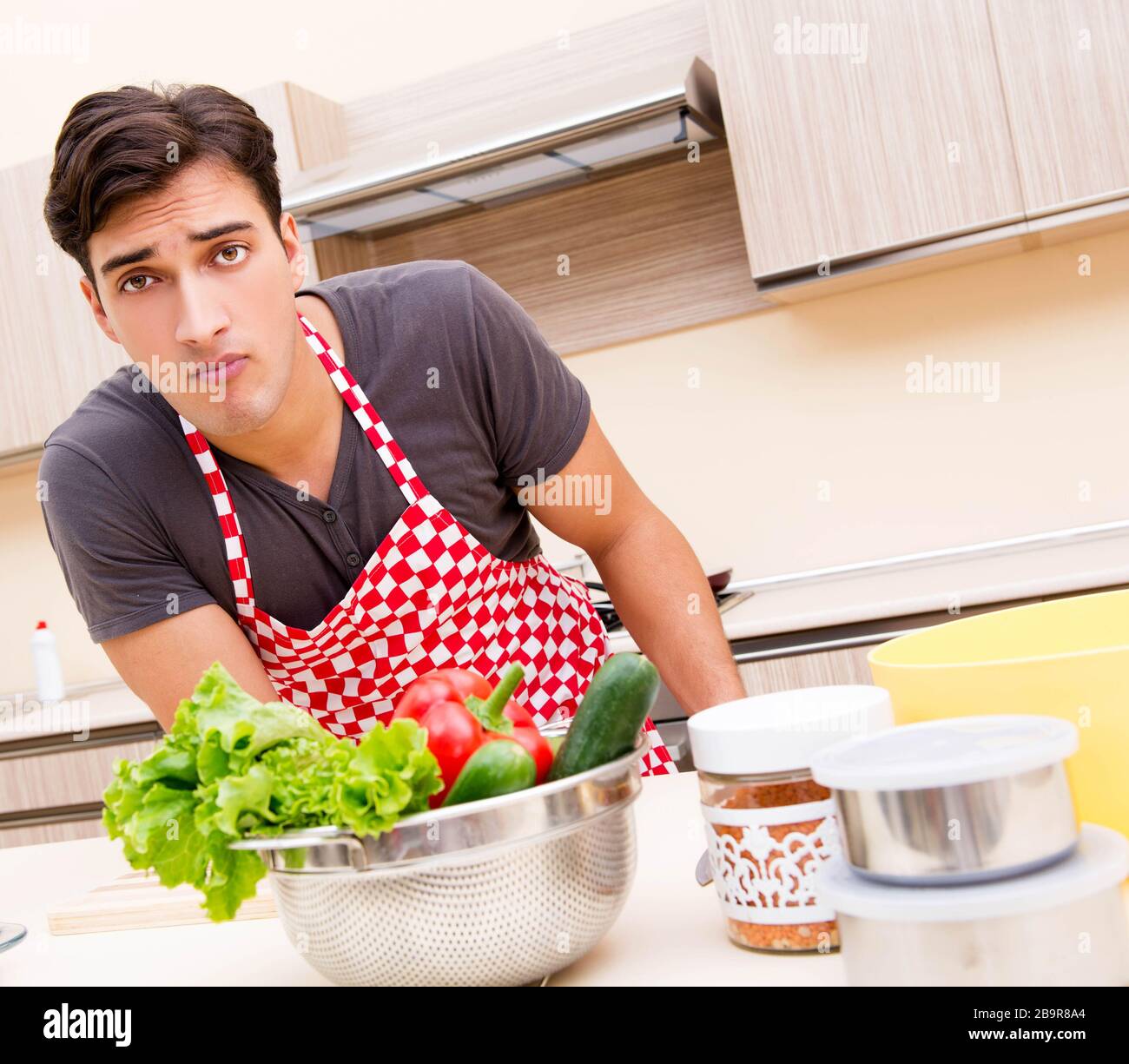 The man male cook preparing food in kitchen Stock Photo - Alamy